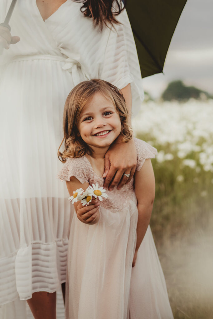 Daisy field photo shoot outdoors after a storm - and then she clicked