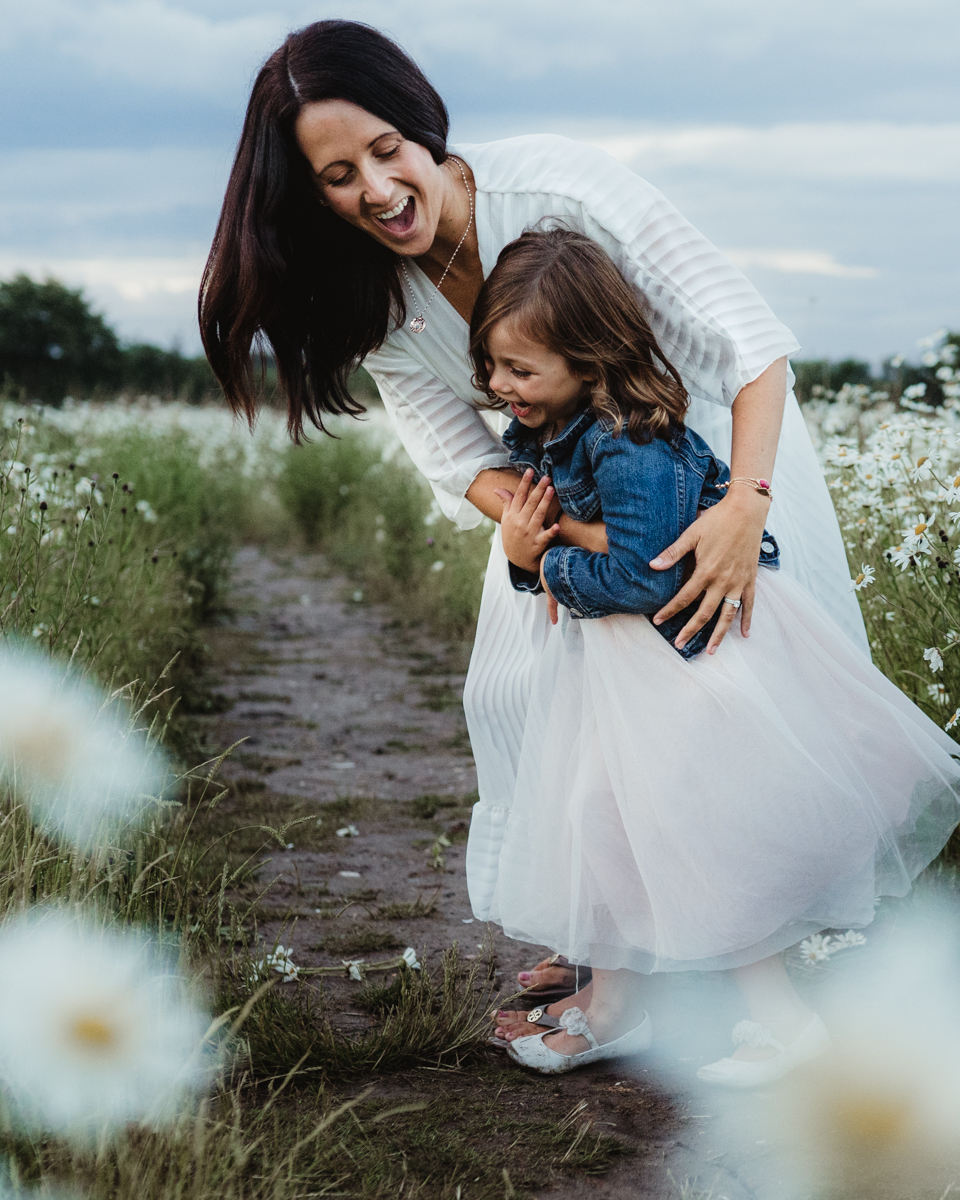 Daisy field photo shoot outdoors after a storm - and then she clicked